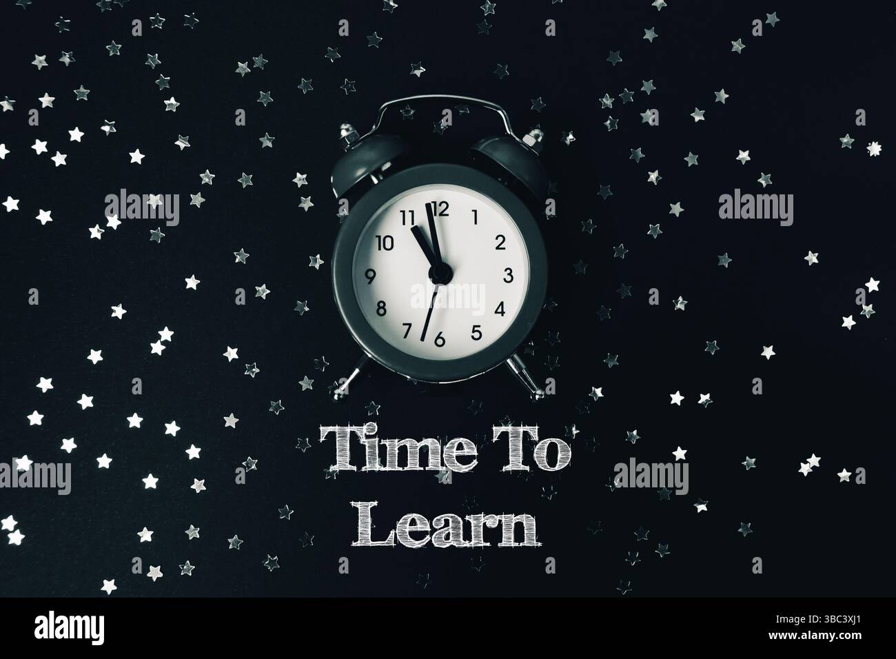 Black and white clock with text time to learn. back to school concept ...