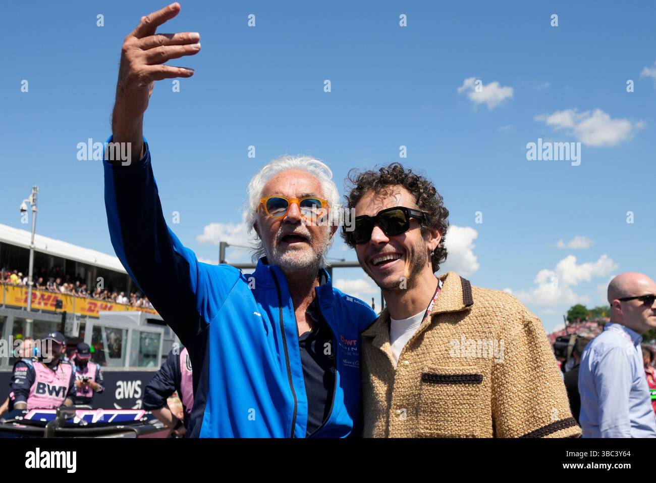 Alpine team principal Flavio Briatore, left, is on the starting grid ...