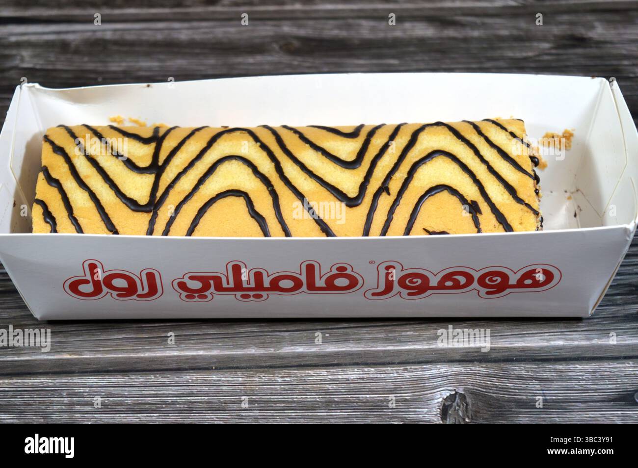 Cairo, Egypt, May 10 2025: Rolled golden cake with cocoa cream filling HOHOS by Edita food ...