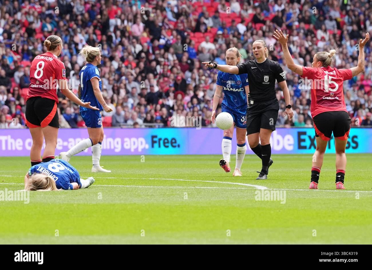 Referee Stacey Fullicks (centre) awards a penalty to Chelsea after ...