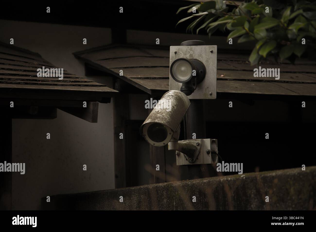 A security camera mounted on a traditional Japanese building ...