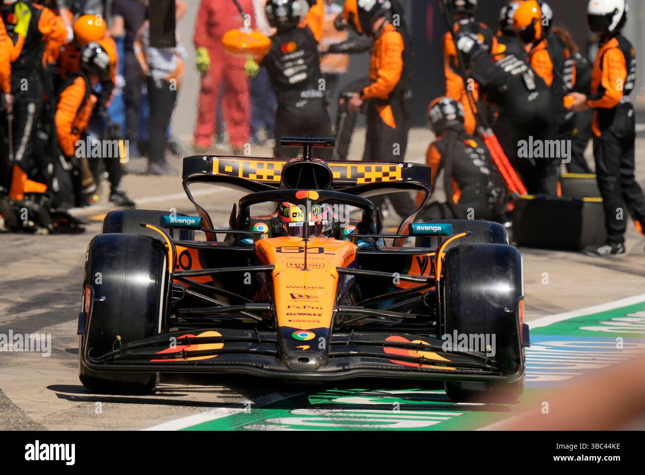 McLaren driver Oscar Piastri of Australia steers his car after a pit ...