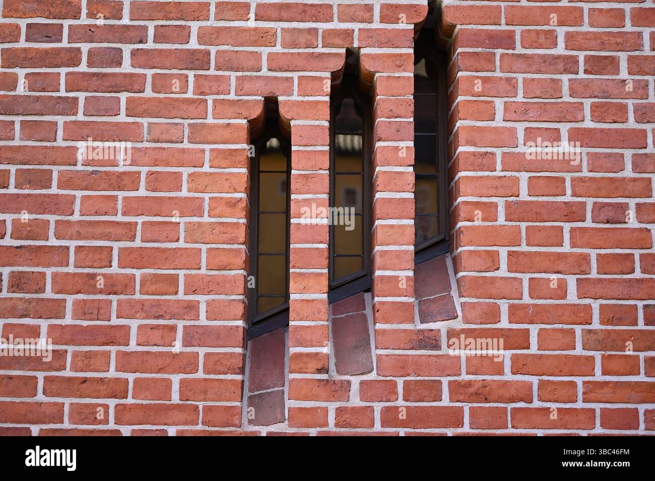 Three narrow windows in the castle wall Stock Photo - Alamy