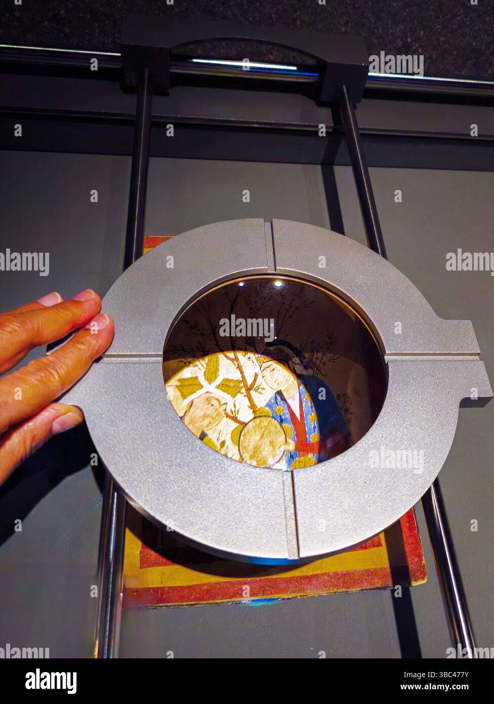 Magnifier is used in museum to display details of old painting Stock ...