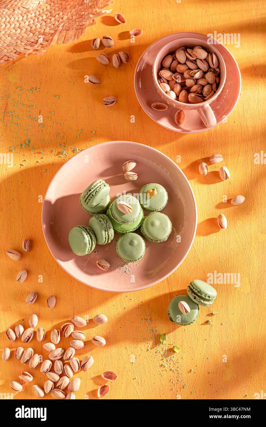 Sweet and creamy pistachio macarons as summer small snack. Green ...