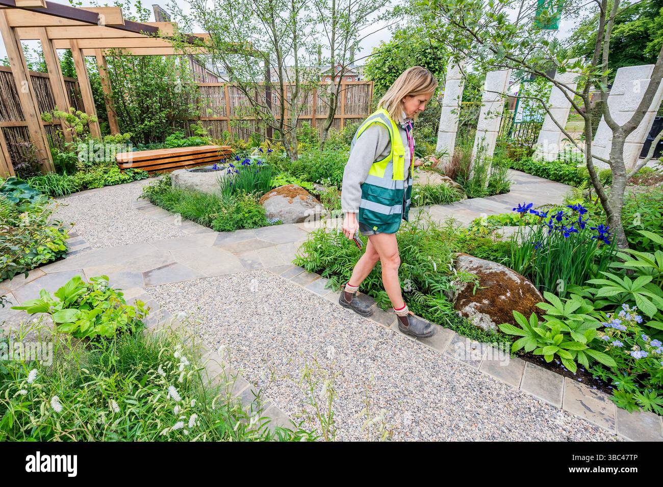 London, UK. 18 May 2025. A member of the production team goes over the ...