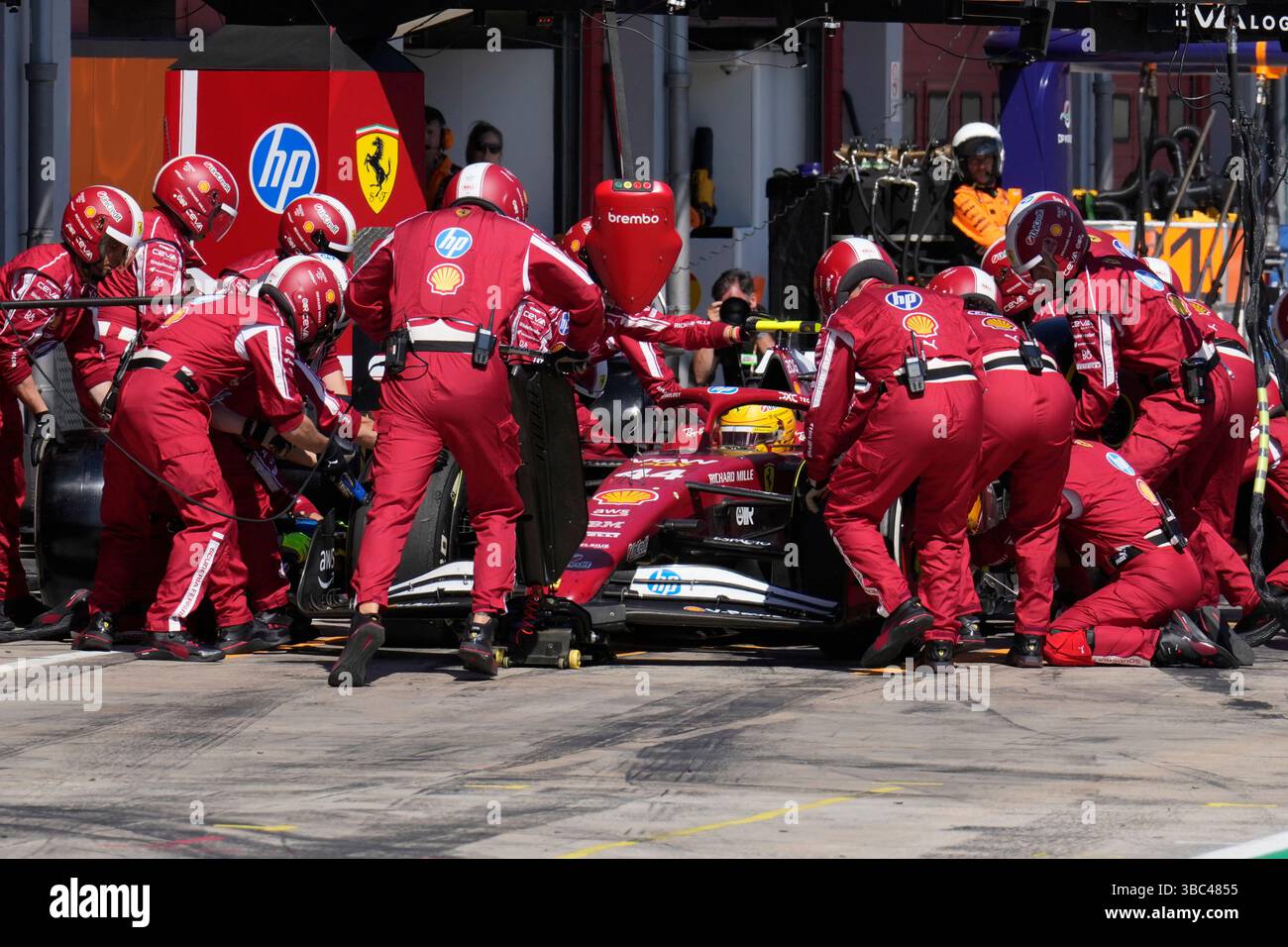 Ferrari driver Lewis Hamilton of Britain gets a pit service during the ...