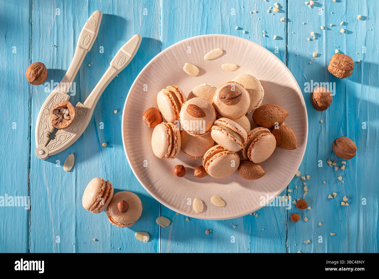 Delicious and sweet nut macarons as summer small snack. Brown macarons ...
