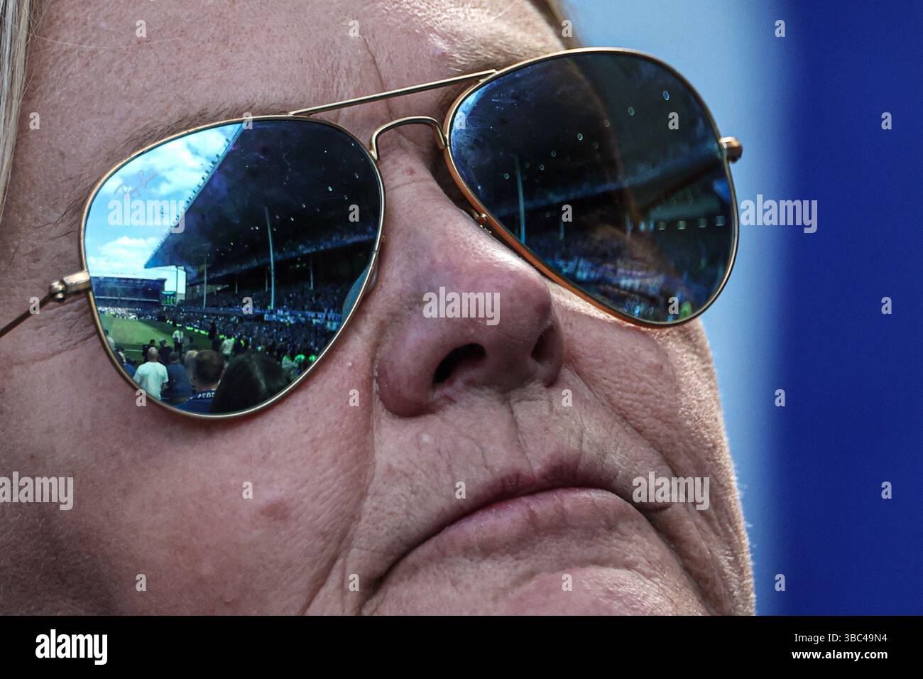 Refection of Goodison Park in Everton fans ray bands celebrating the ...