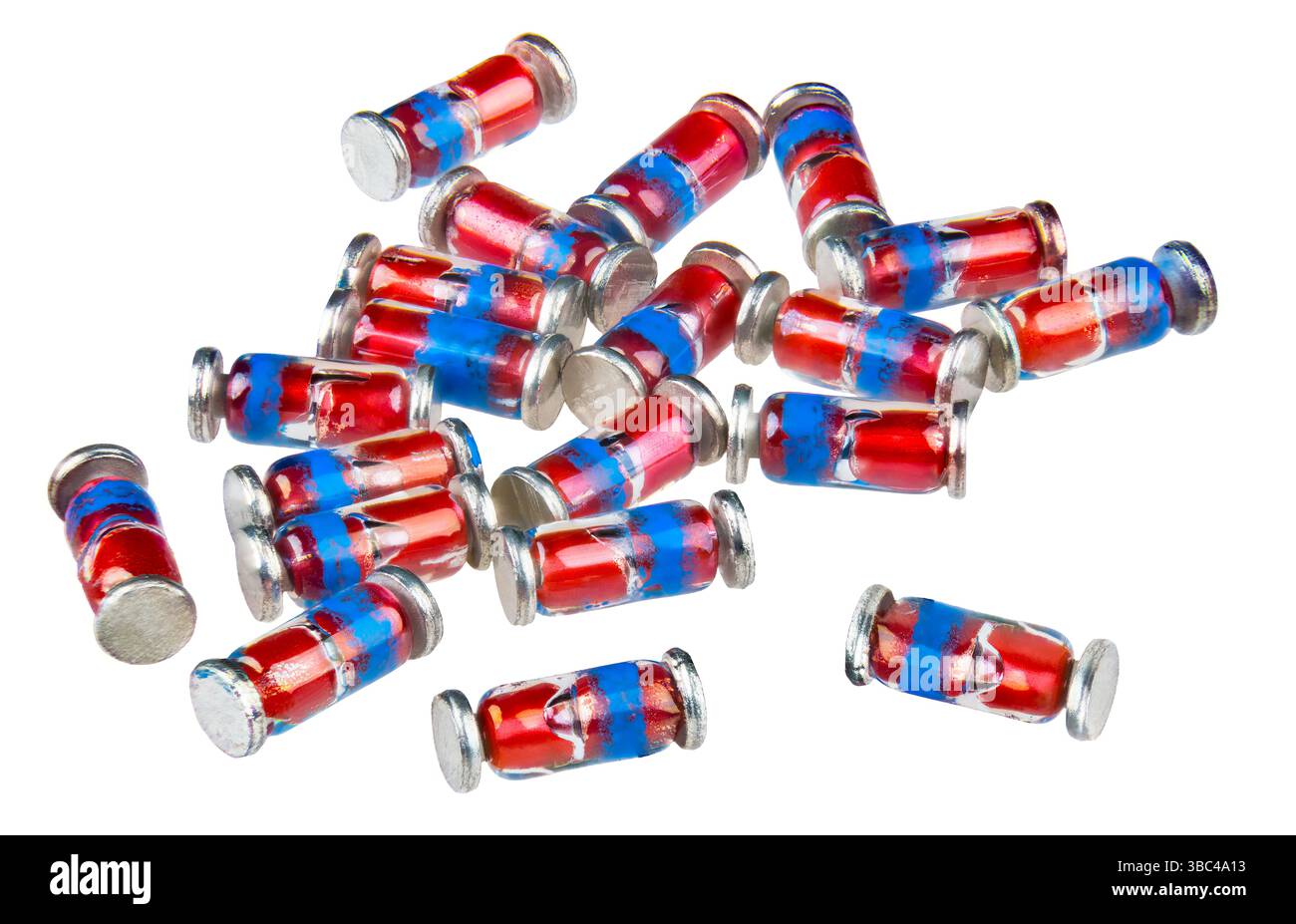 Set of cylindrical SMD Zener diodes in red blue glass tubes isolated on ...