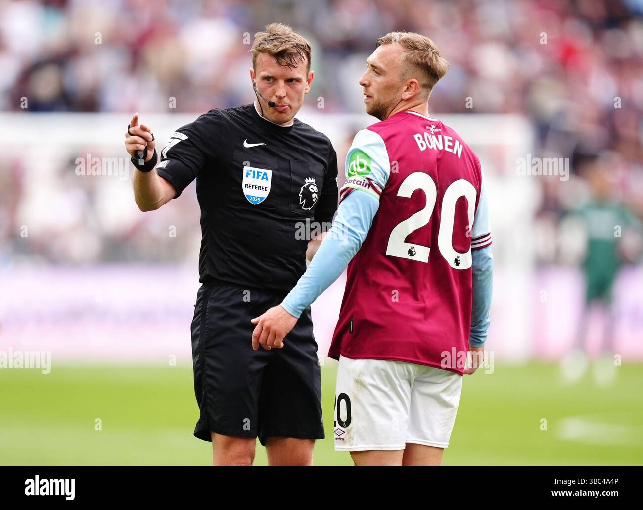 Referee Sam Barrott addresses West Ham United's Jarrod Bowen during the ...