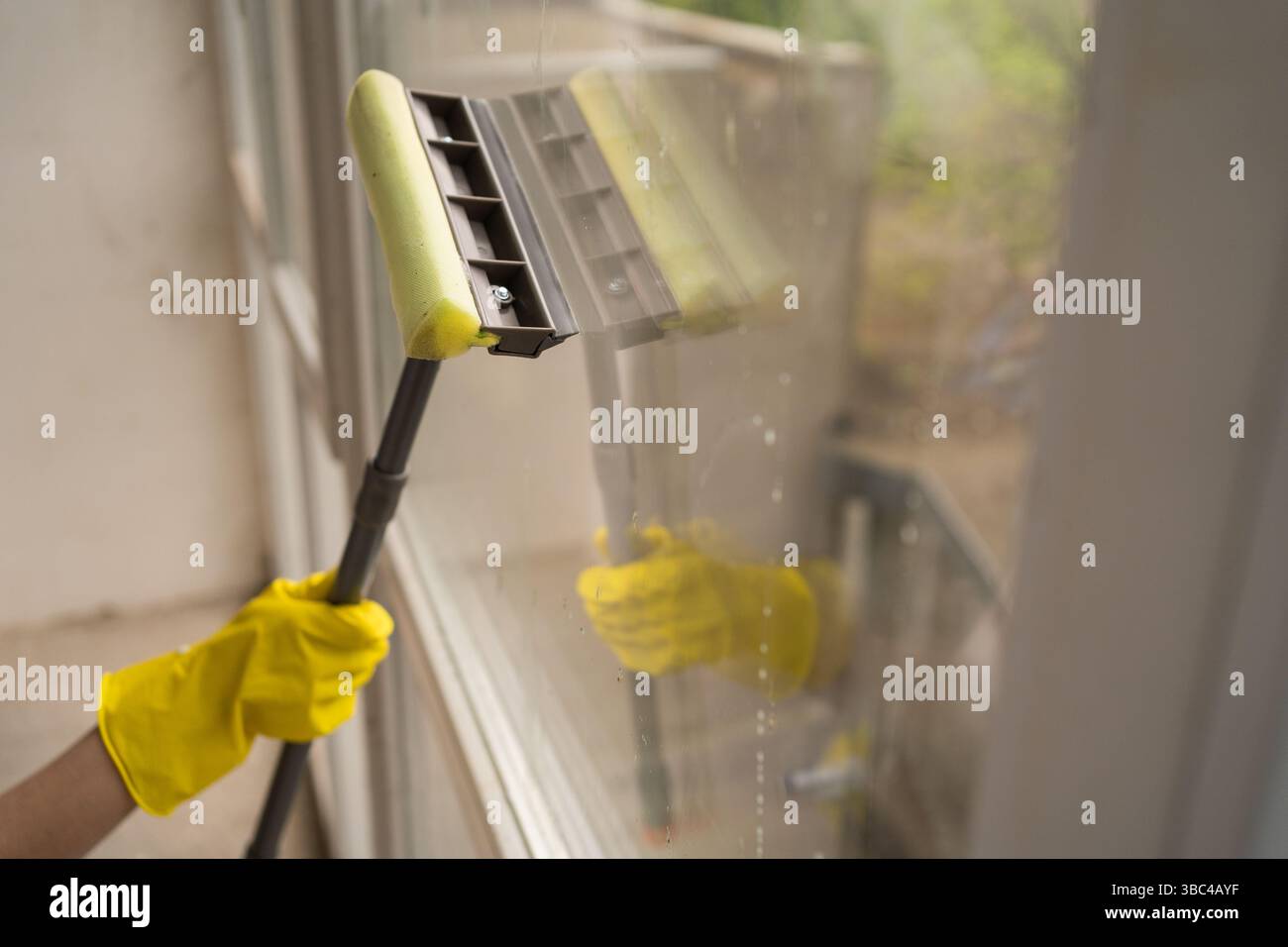 Spring cleaning concept. Washing windows. Cleaner washing a windows ...