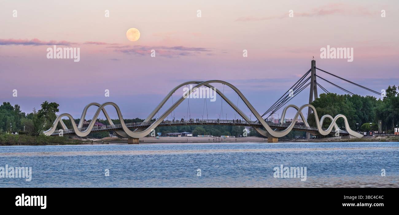 Full moon rising over the Pedestrian Bridge in Kyiv, Ukraine ...
