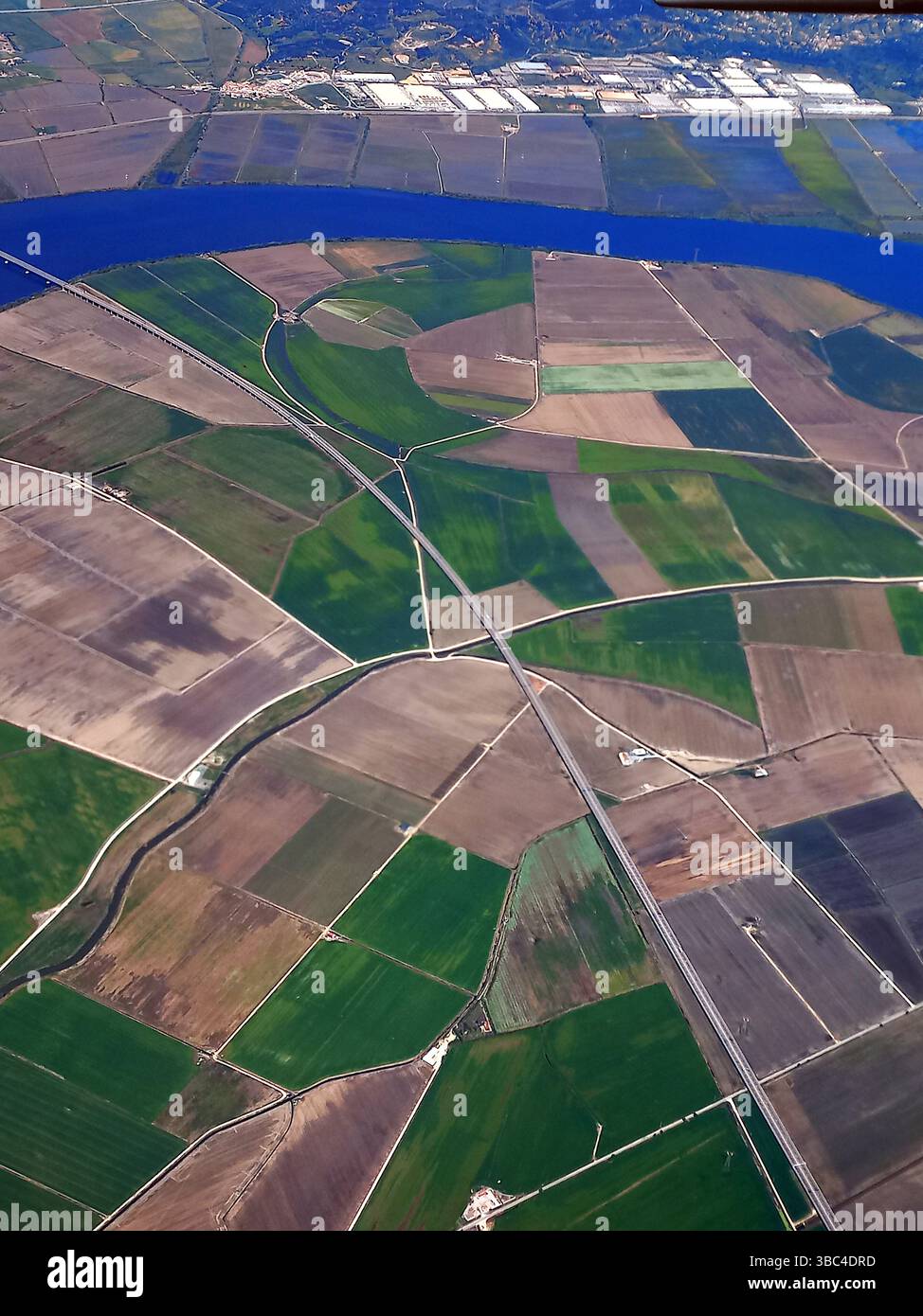 Vivid aerial capture of agricultural plots in various shades of green ...