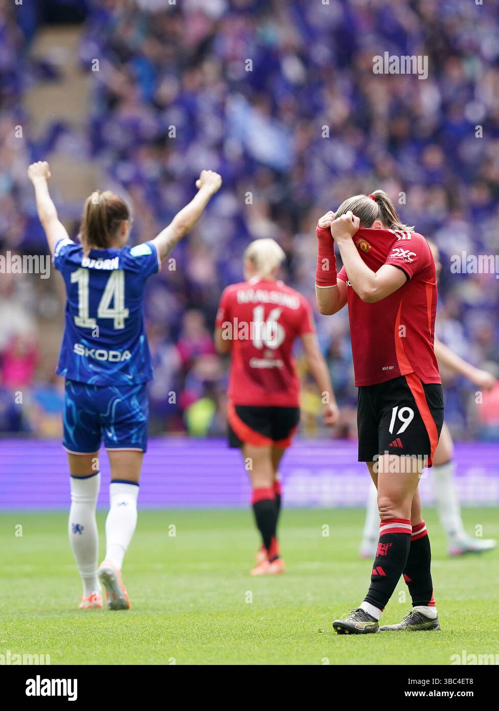 Manchester United's Elisabeth Terland (right) stands dejected after ...