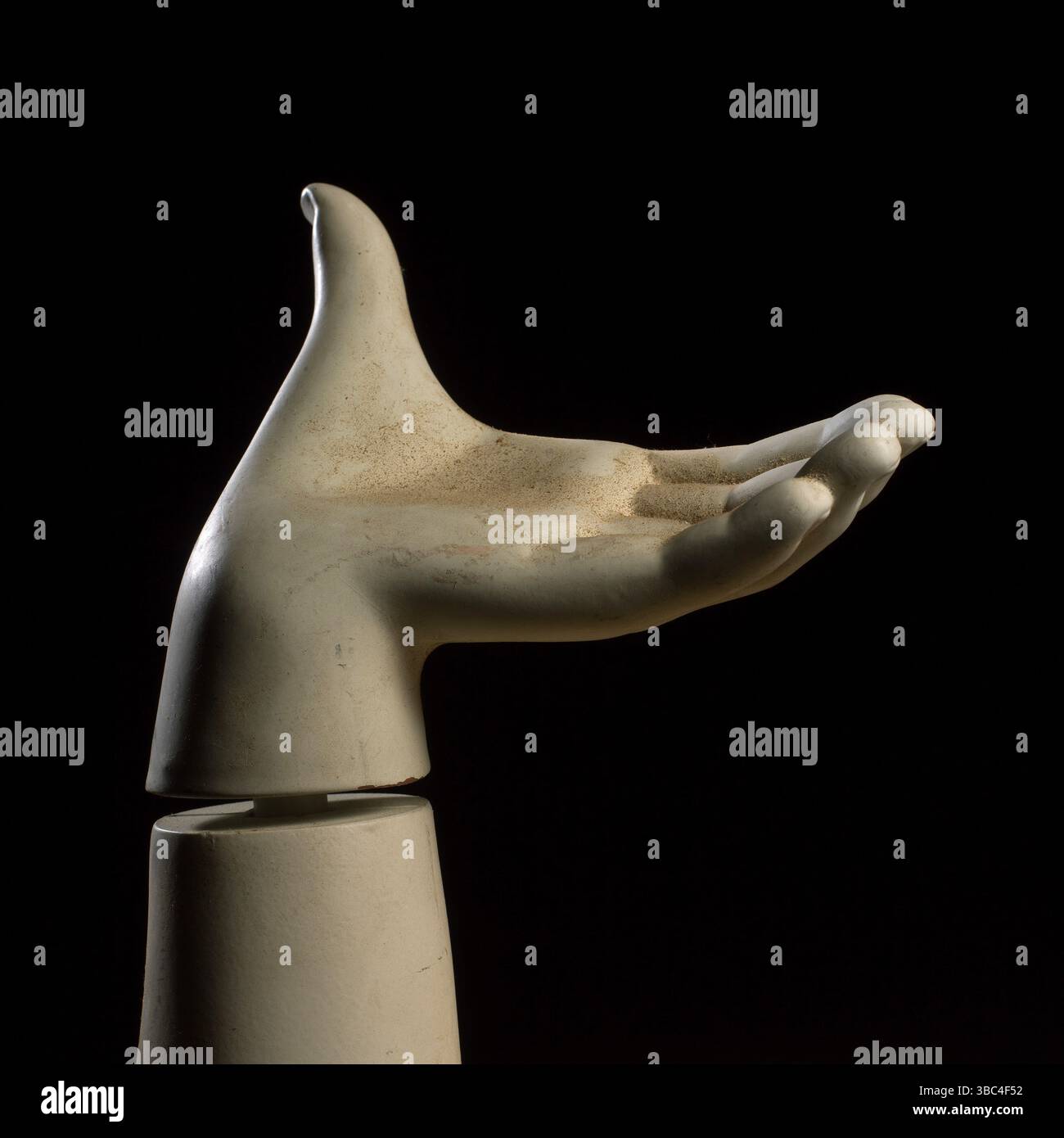 A detailed view of a mannequin hand with fingers slightly curled ...