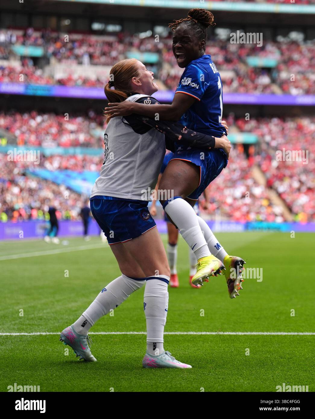 Chelsea's Sandy Baltimore (right) celebrates scoring their side's third ...