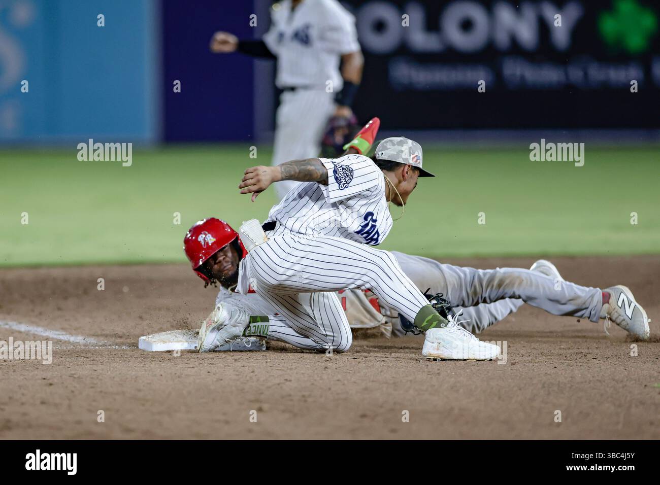 Tampa, FL USA: Tampa Tarpons pitcher Danny Flatt (25) safely steals ...