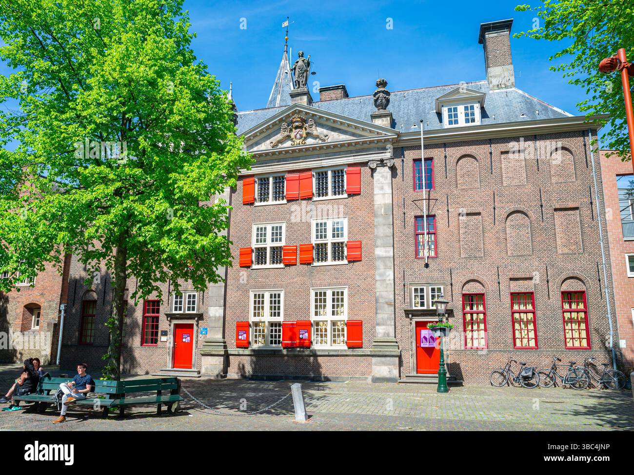 Scenic monumental building “Gravensteen” with red shutters behind the ...