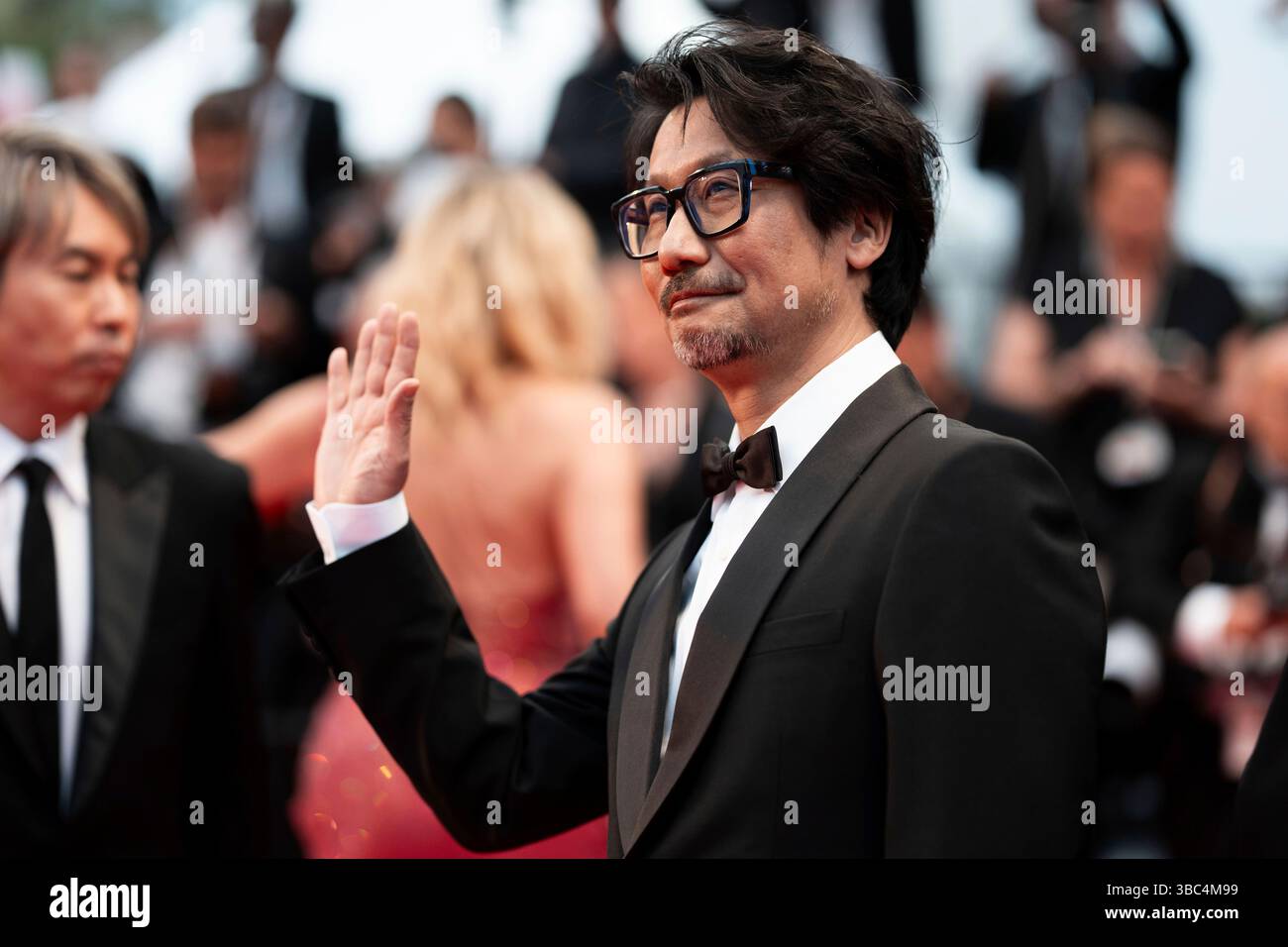 Hideo Kojima poses for photographers upon arrival at the premiere of ...