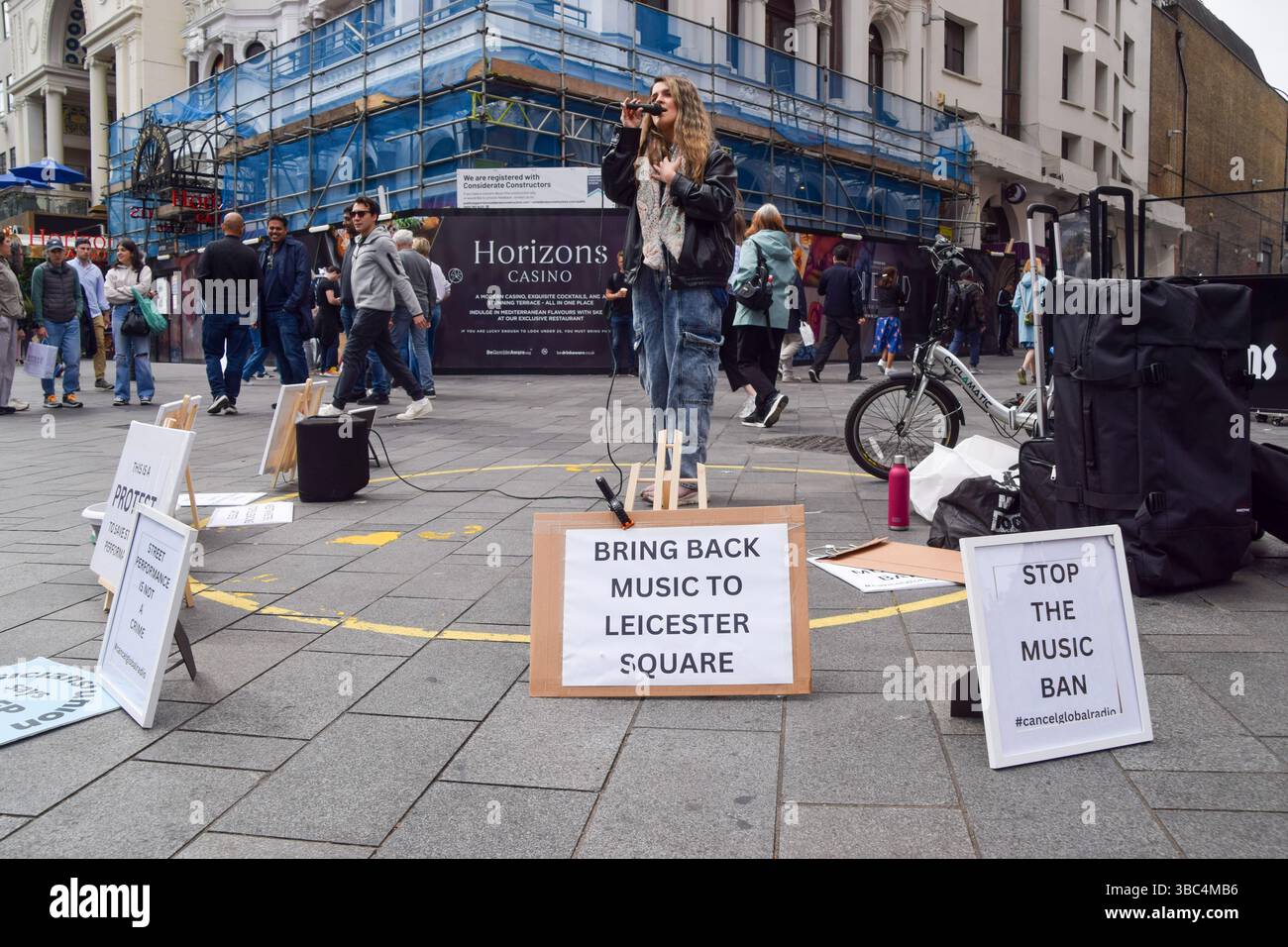 May 18, 2025, London, England, United Kingdom: A busker performs in ...