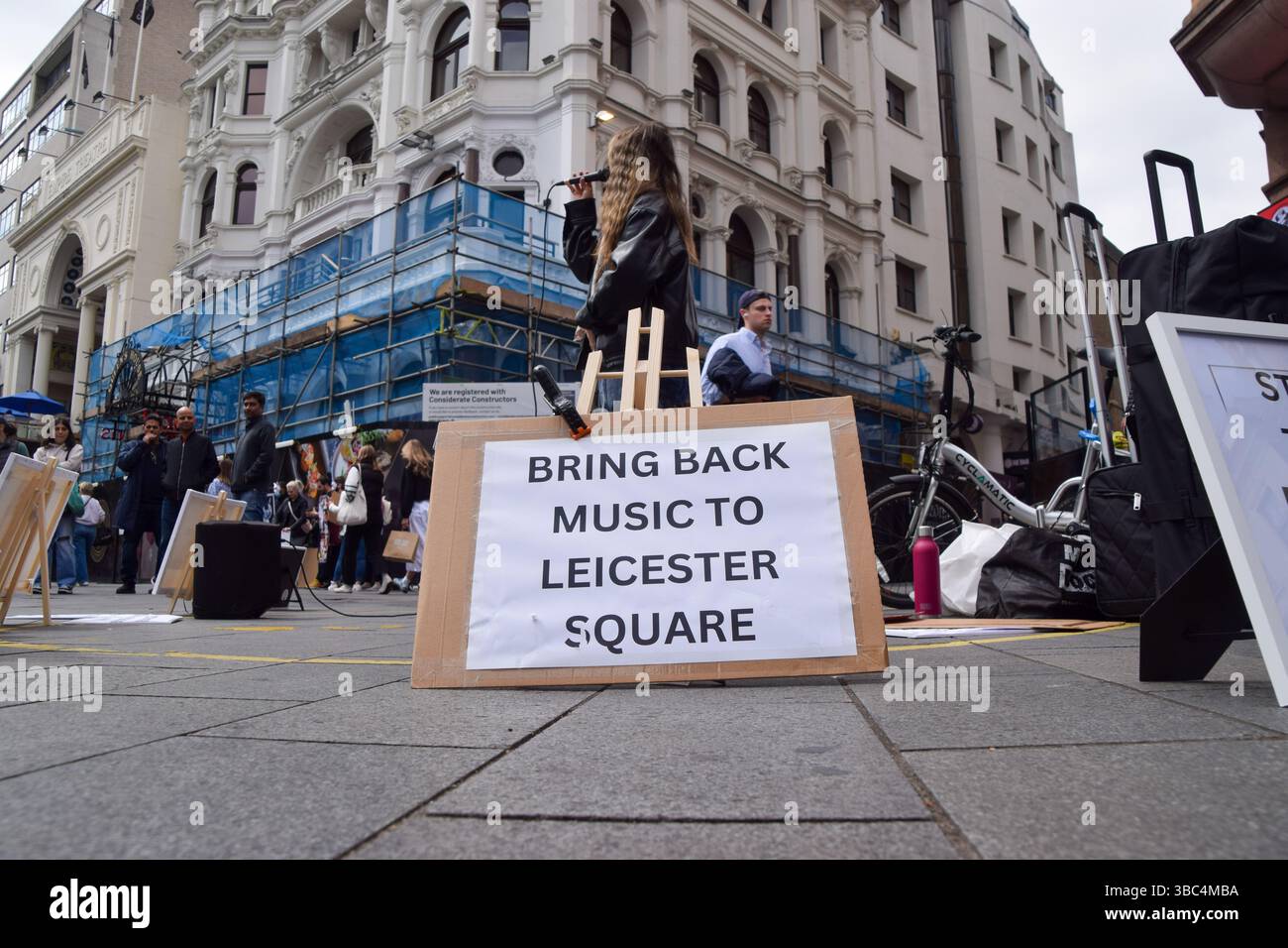 May 18, 2025, London, England, United Kingdom: A busker performs in ...