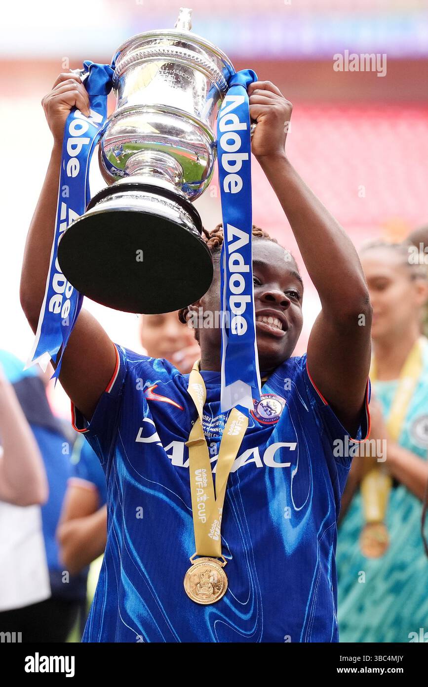 Chelsea's Sandy Baltimore celebrates with the trophy after the Adobe ...