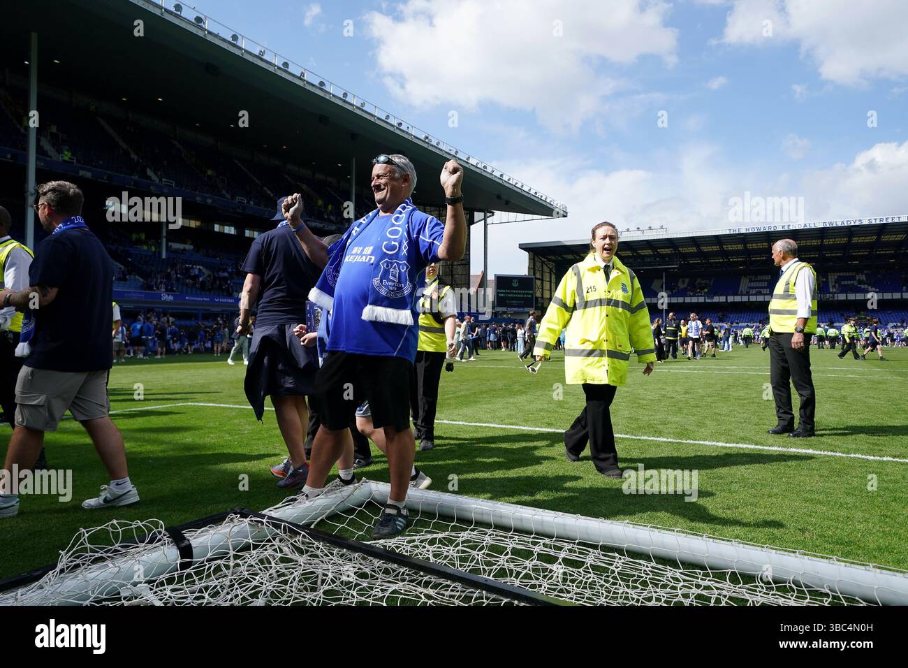 Everton fans on the pitch inside Goodison Park, Liverpool after the ...