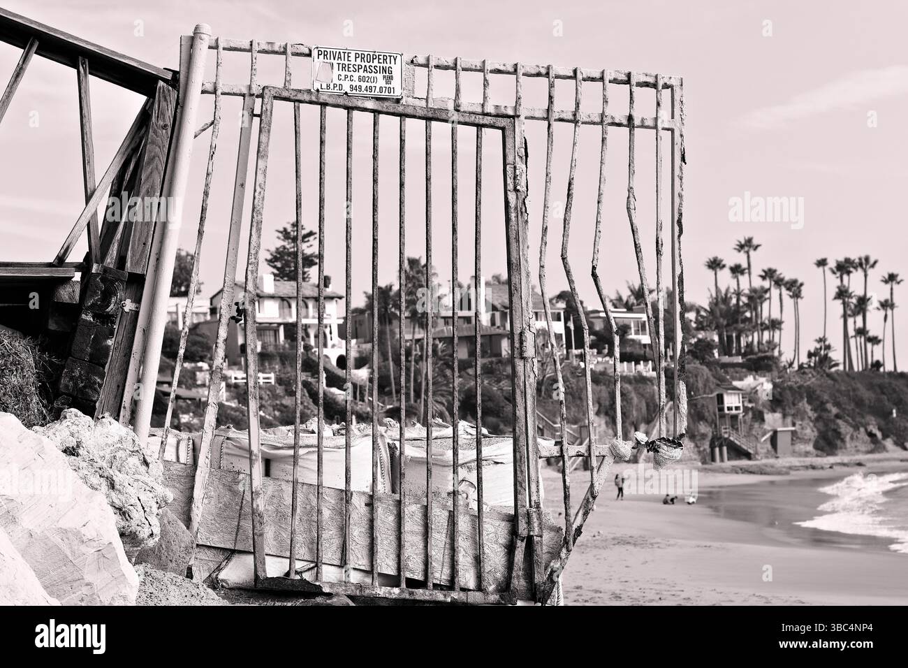 Broken gate at Crescent Bay Beach Stock Photo - Alamy
