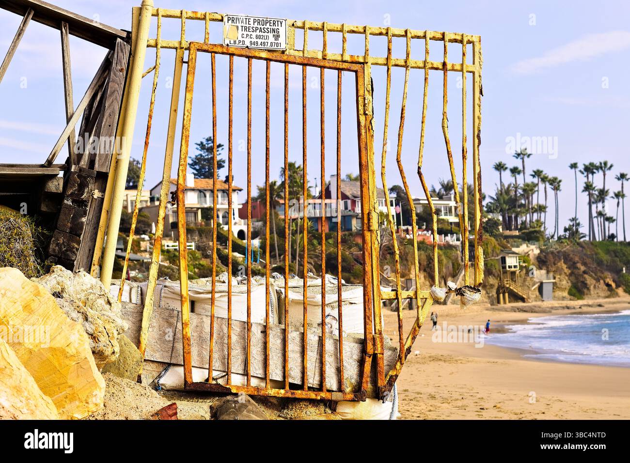 Broken gate at Crescent Bay Beach Stock Photo - Alamy