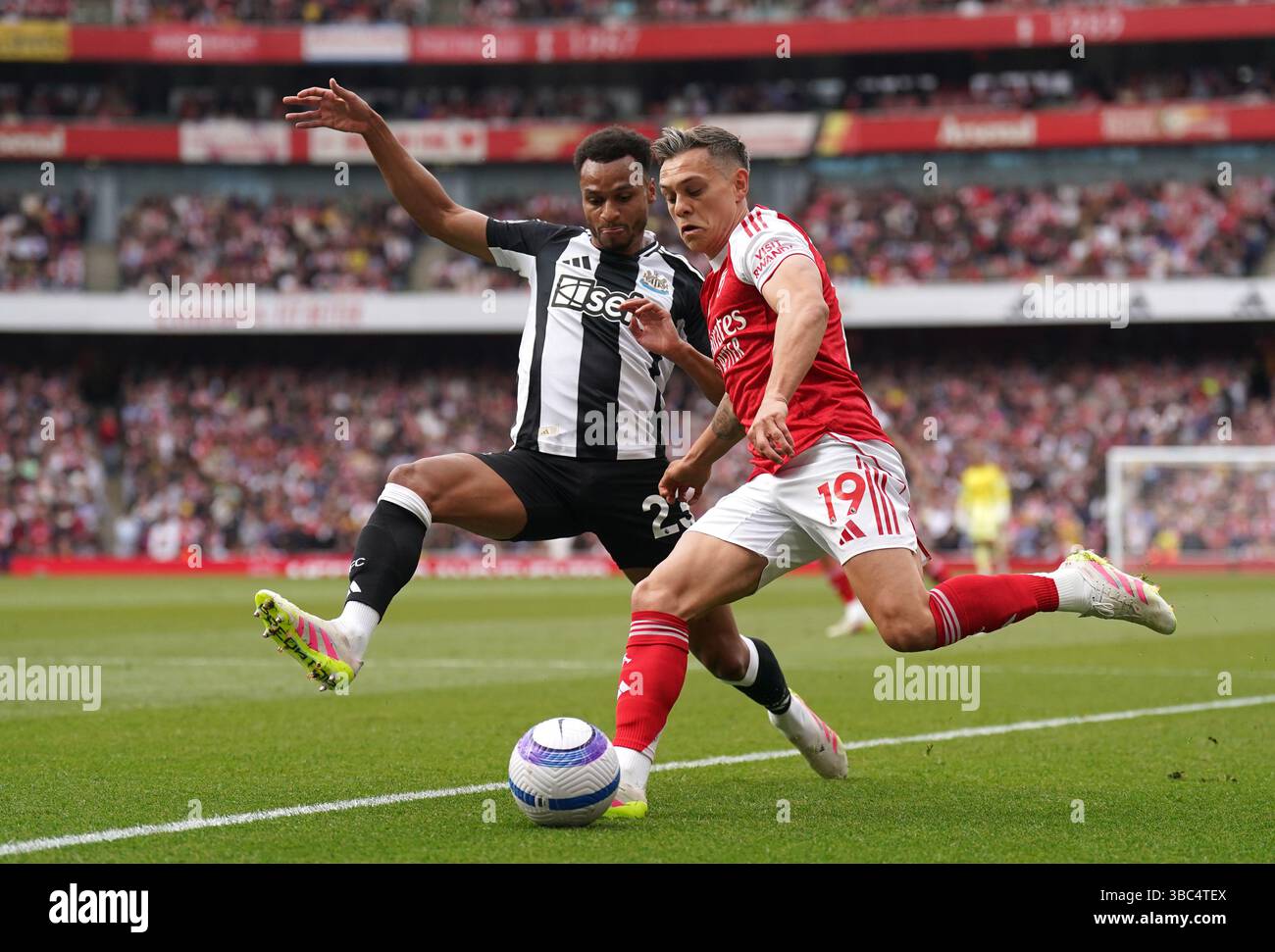 Newcastle United's Jacob Murphy (left) and Arsenal's Leandro Trossard ...