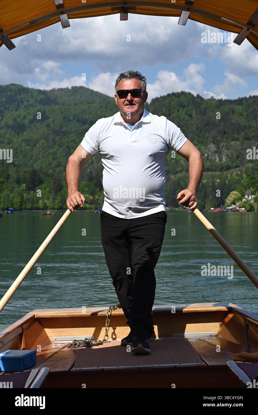 Lake Bled, Bled, Slovenia - May 1 2025: Pletnarstvo oarsman standing ...