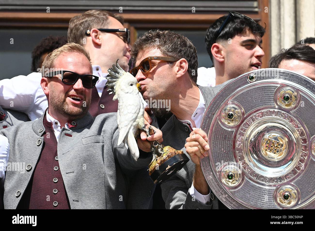Thomas MUELLER (M?LLER, FC Bayern Munich) celebrates on the town hall ...