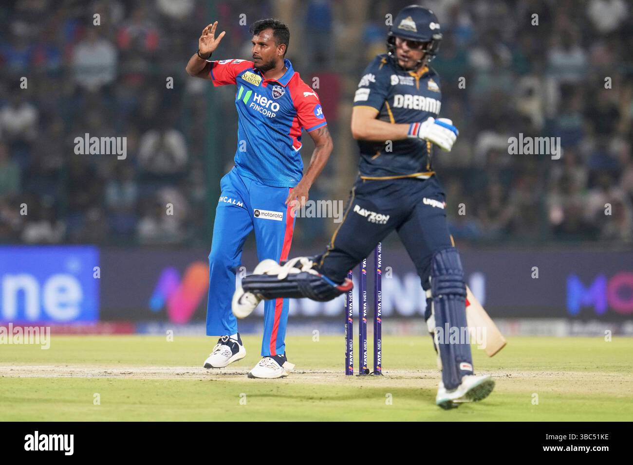 Delhi Capitals' T. Natarajan, left, reacts as Gujarat Titans' captain ...