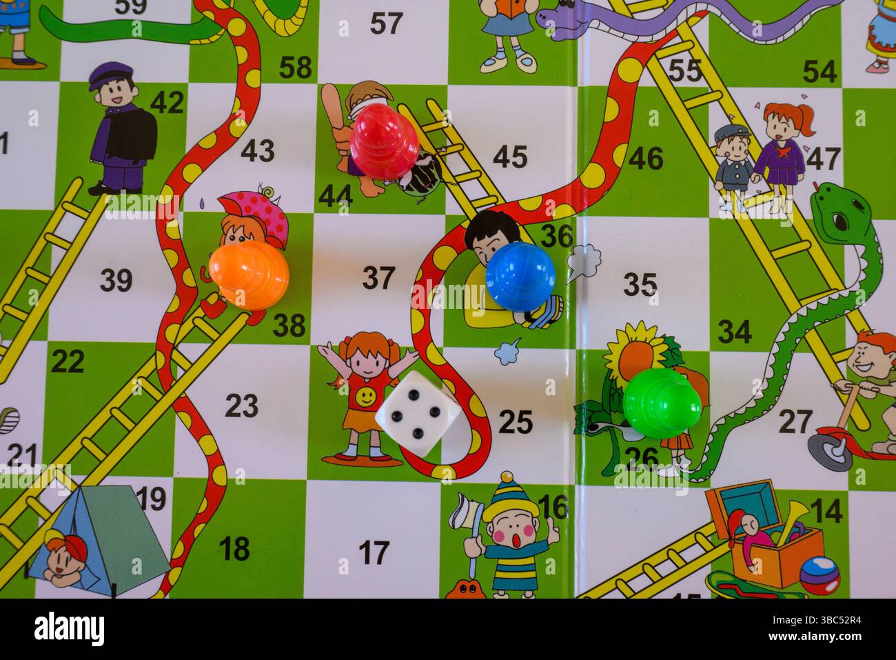 Snakes and Ladders board game Stock Photo - Alamy