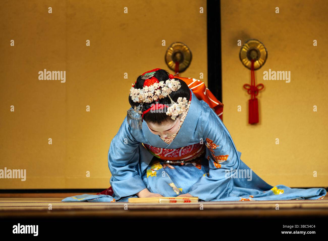 A geisha performer performing a kyo-mai dance at Yasaka Hall Gion ...