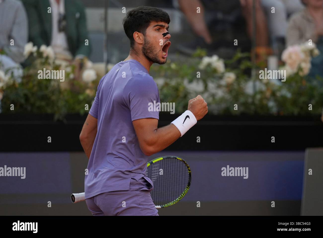 Carlos Alcaraz of Spain, reacts after scoring a point against Jannik Sinner of Italy during ...