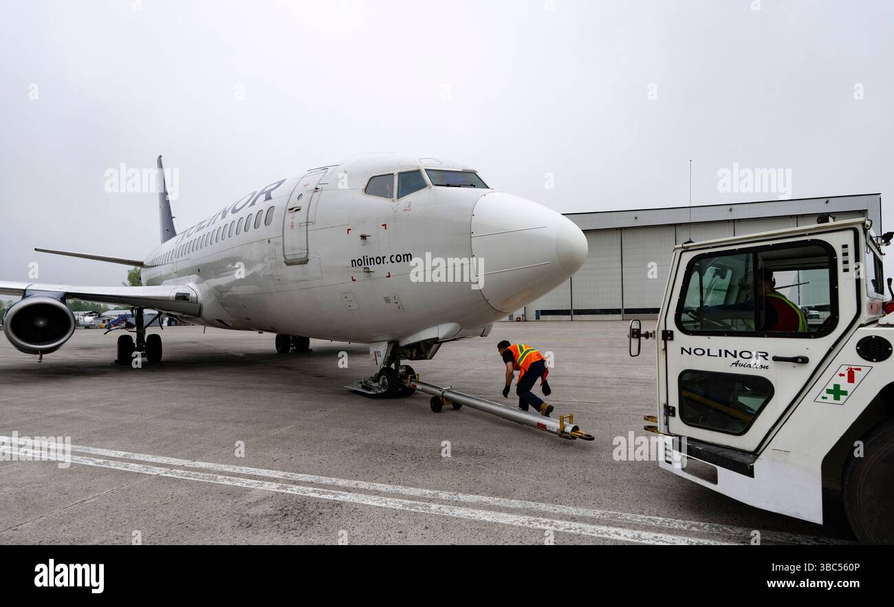 Mirabel, Canada. 17th May, 2025. A ground crew secures a 42 year old ...