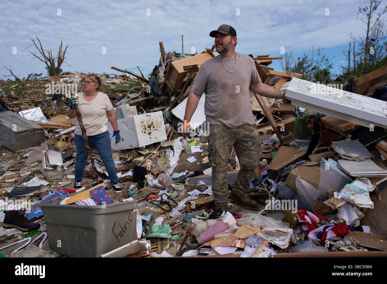 Edwina Wilson, left, and family friend Melvin Brock sift through what ...