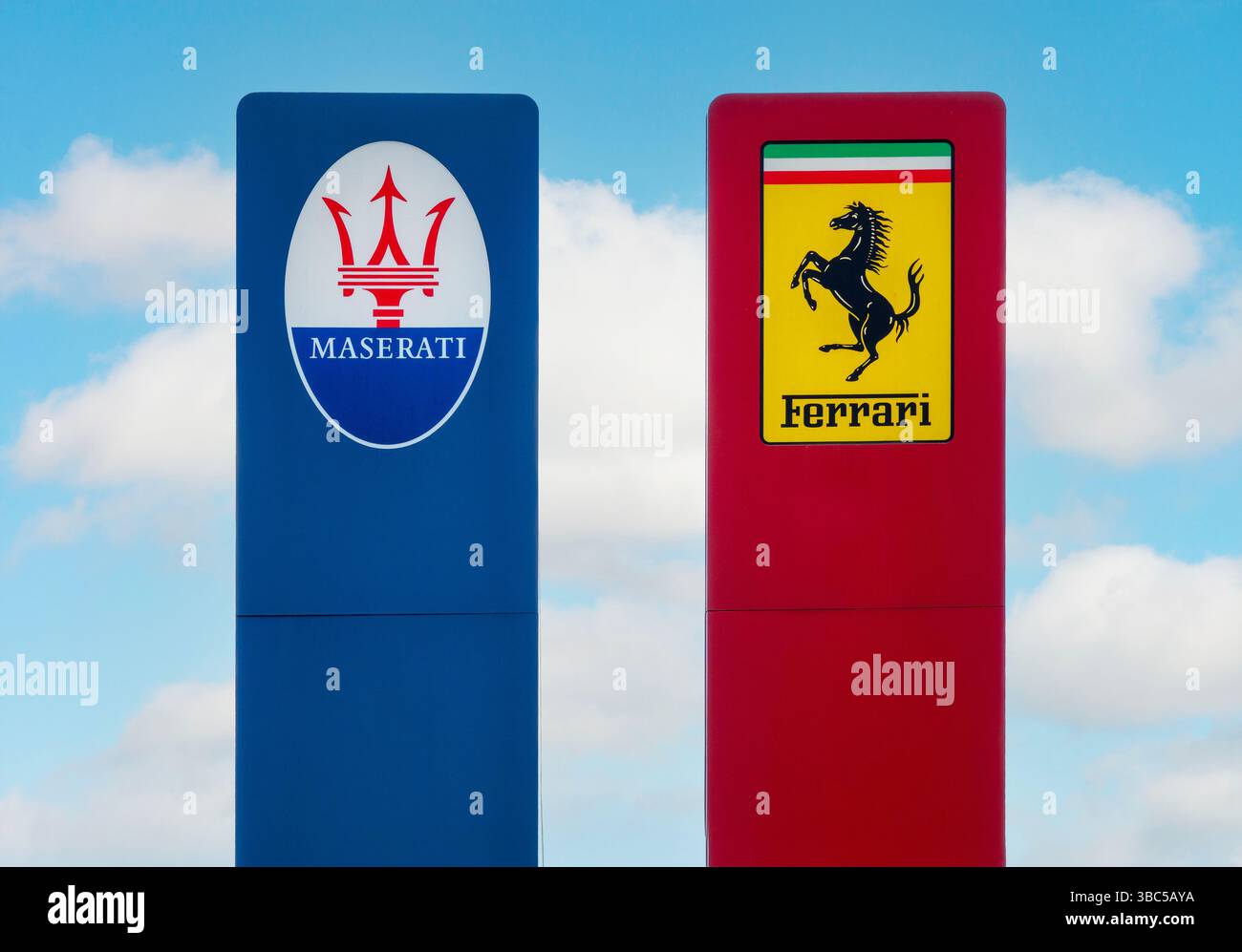 Totem signage of Italian sports car brands Maserati and Ferrari dealer ...