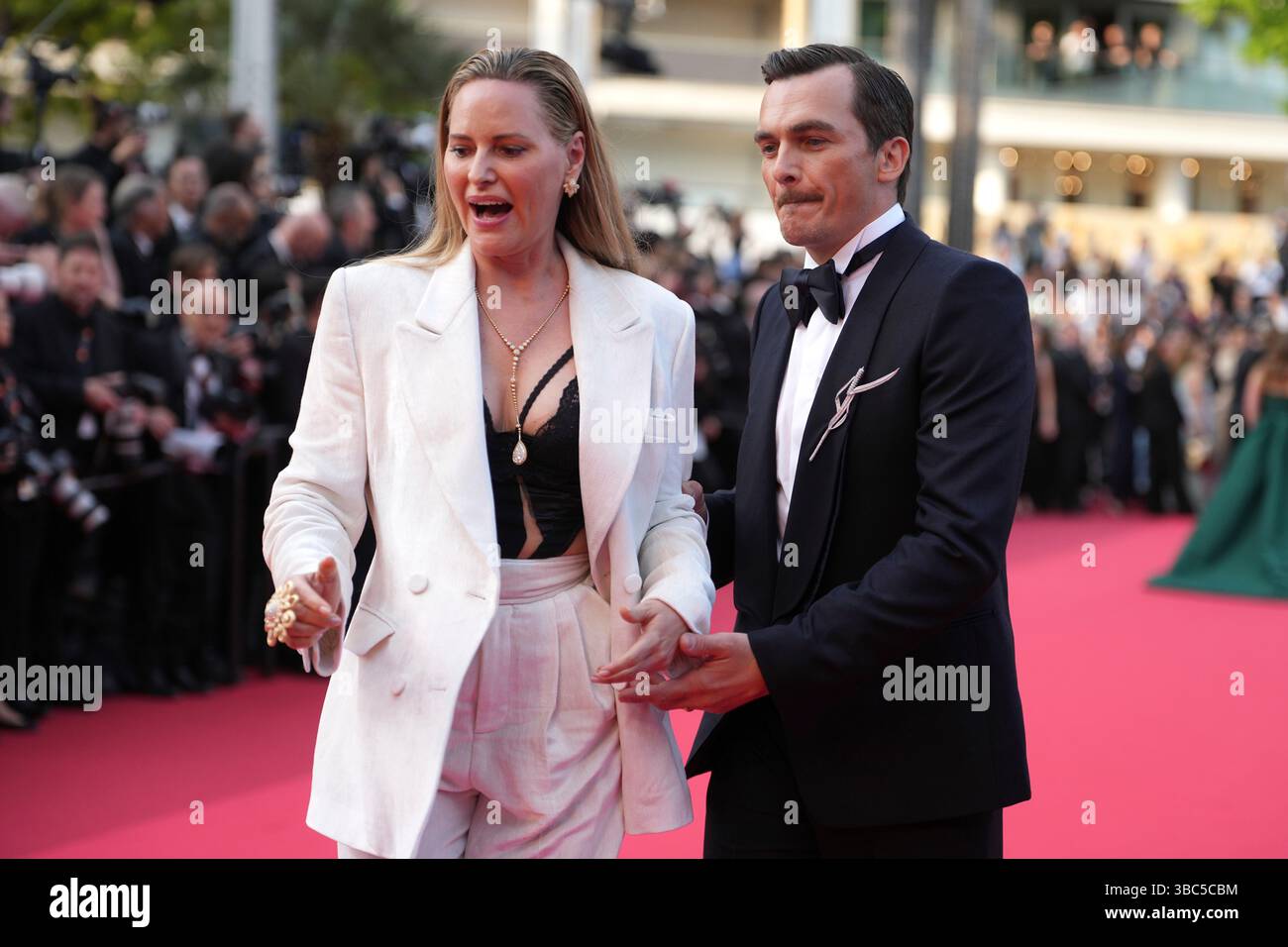 Aimee Mullins, left, and Rupert Friend pose for photographers upon ...
