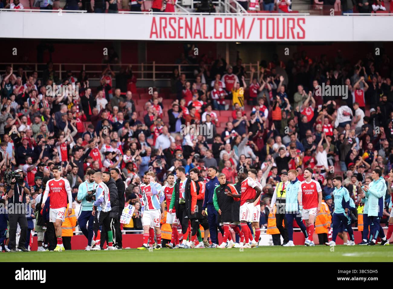Arsenal players in a lap of honour around the stadium following the ...