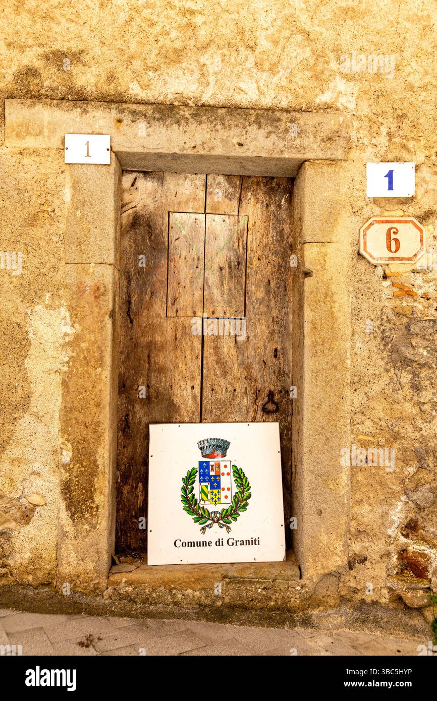 Wooden door with Graniti municipal sign Stock Photo - Alamy