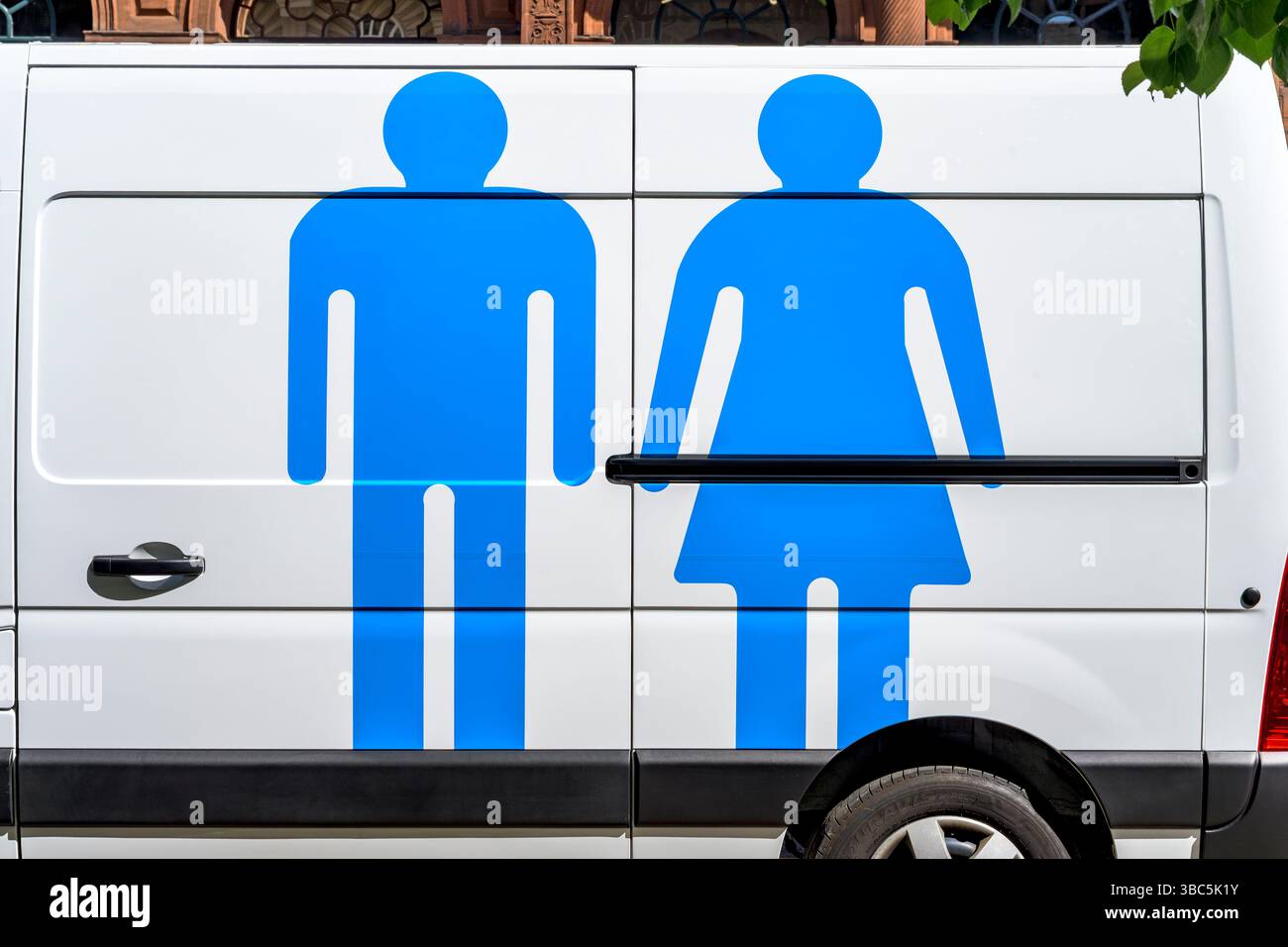 Male and Female Public Toilet sign on the side of a service van, UK ...
