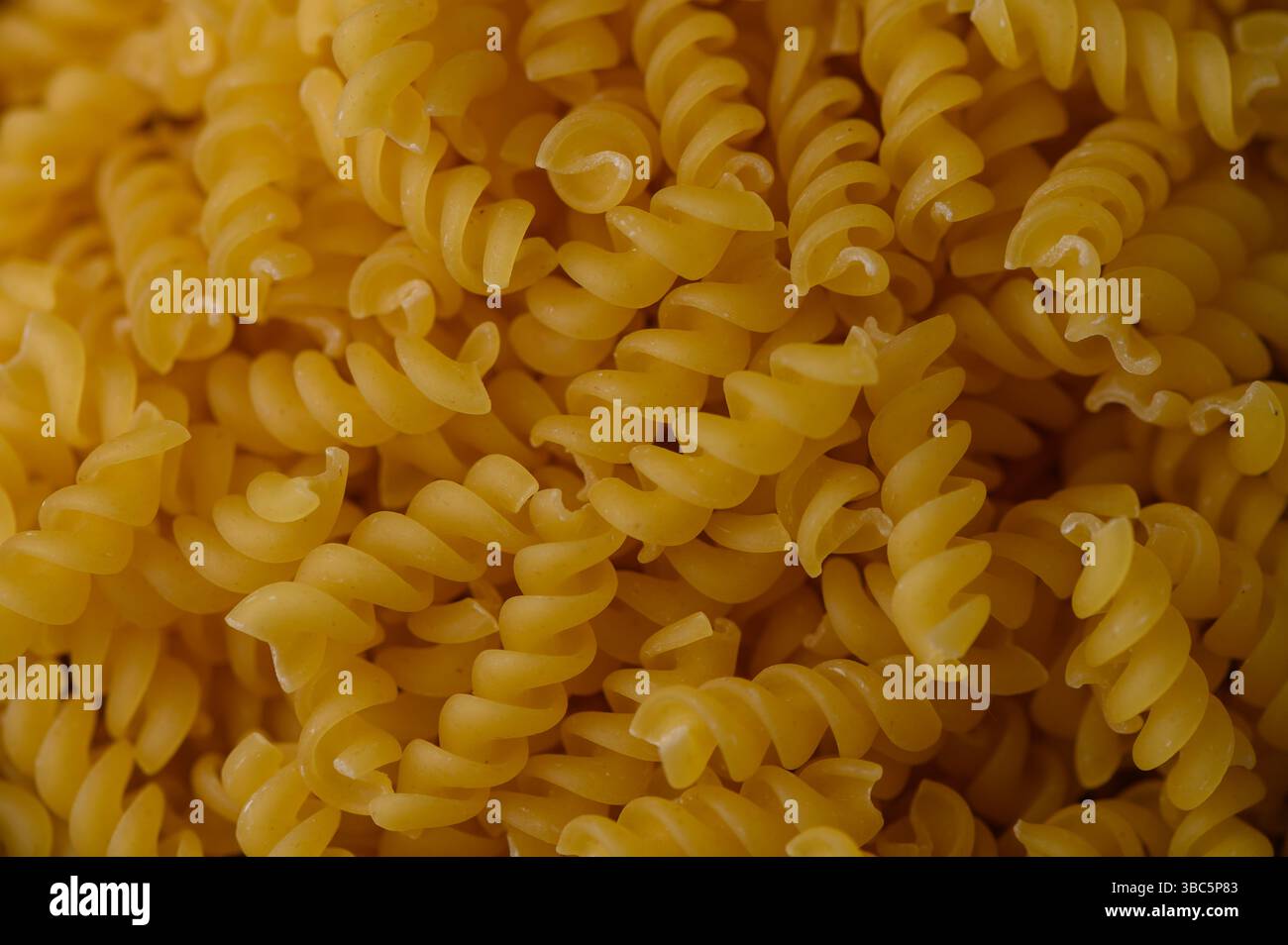 Dry Fusilli Pasta Full Frame Background Stock Photo - Alamy