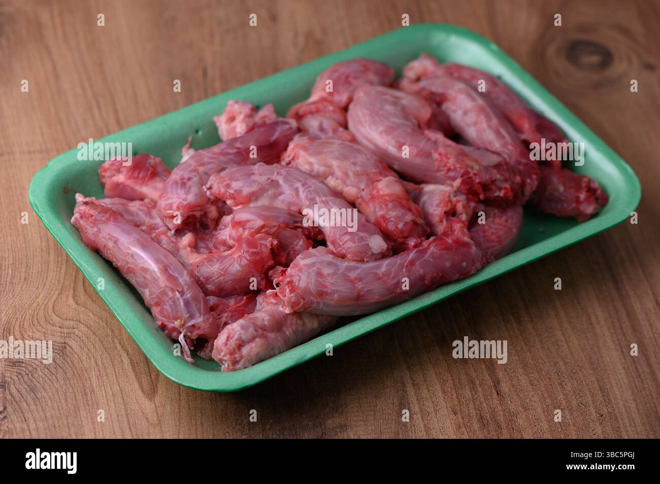 Raw chicken necks in hi-res stock photography and images - Alamy