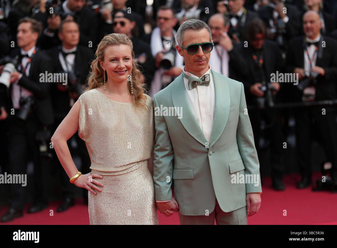 Emma Wall, left, and jury member Jeremy Strong pose for photographers ...