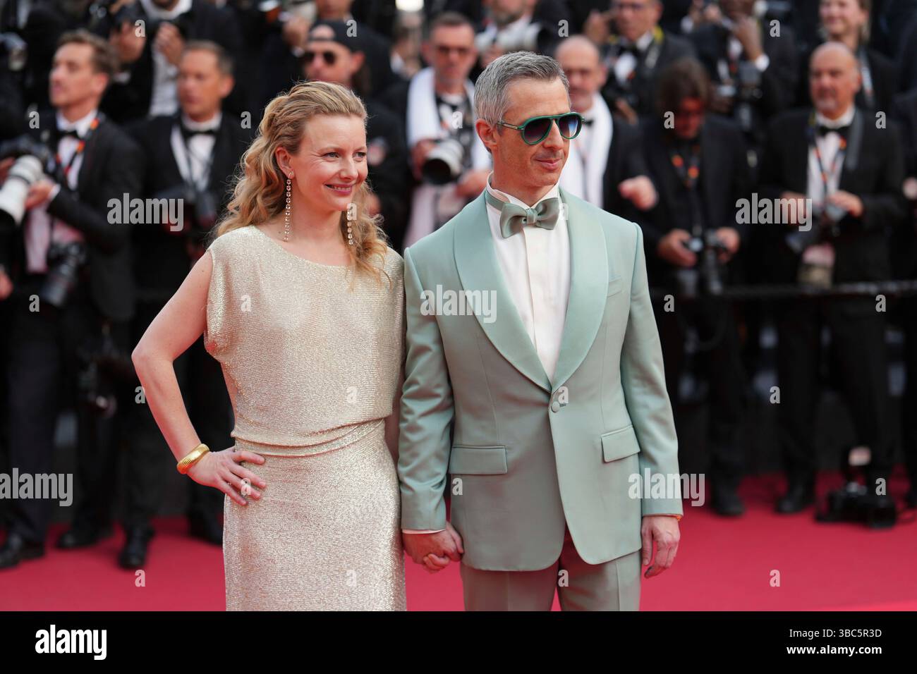 Emma Wall, left, and jury member Jeremy Strong pose for photographers ...