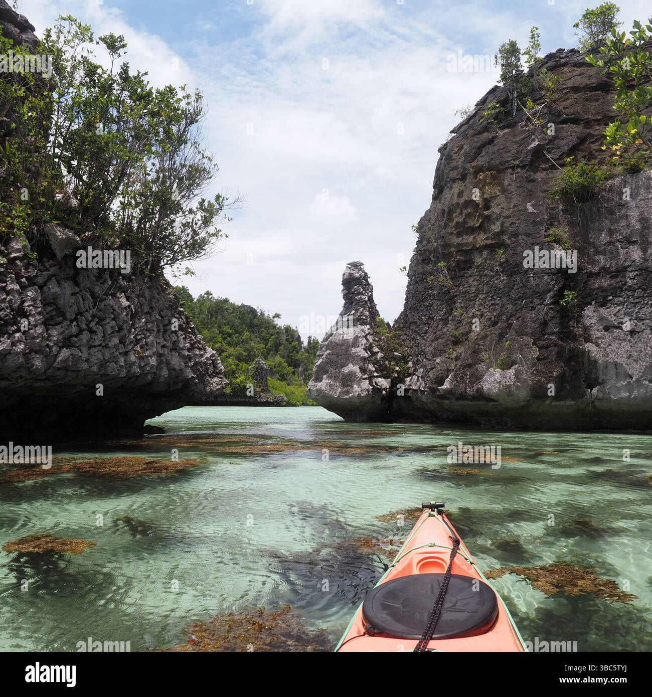 Kayaking around rock formations in Raja Ampat, Misool, West Papua ...