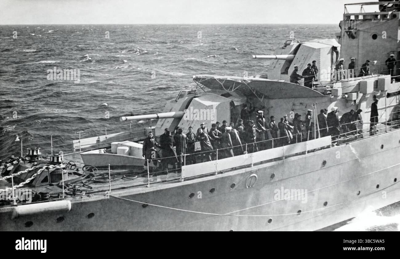 The Royal Navy destroyer HMS Chieftain (R36) with crew members on deck ...